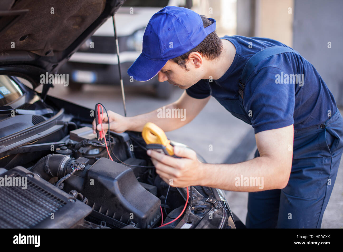 Car electrician troubleshooting a car engine Stock Photo - Alamy