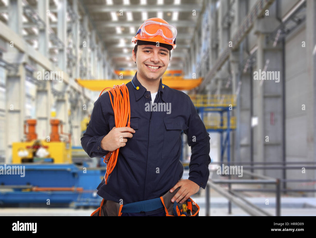 Portrait of an engineer at work in a factory Stock Photo - Alamy