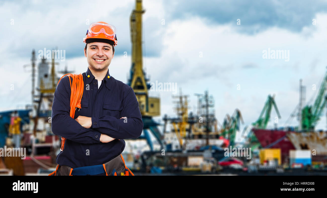 Portrait of a worker in front of an harbor Stock Photo - Alamy
