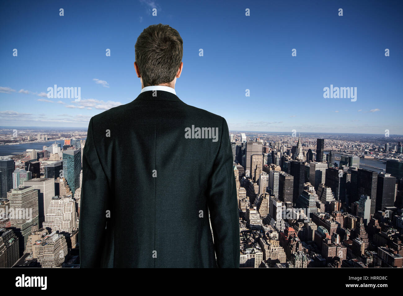 Businessman looking at the city Stock Photo - Alamy