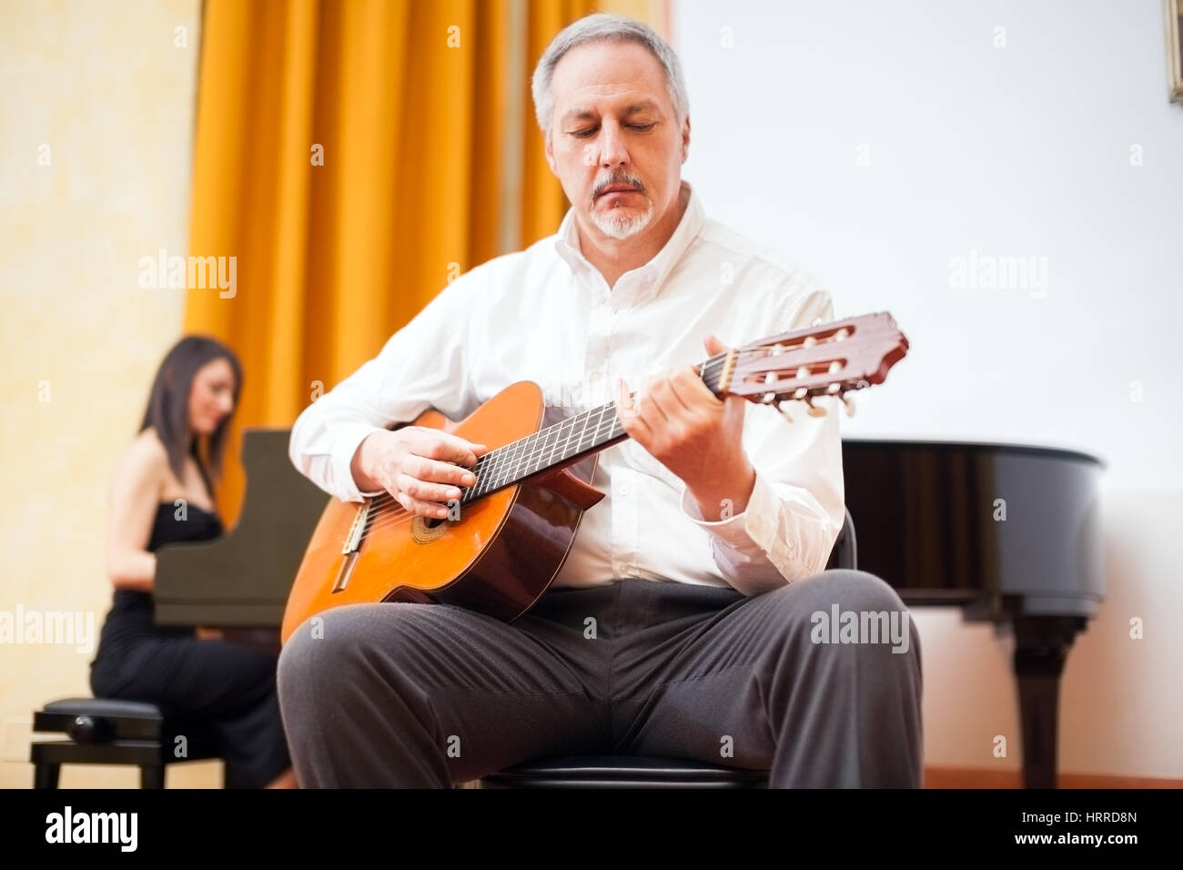Man playing classical guitar in hi-res stock photography and images - Alamy