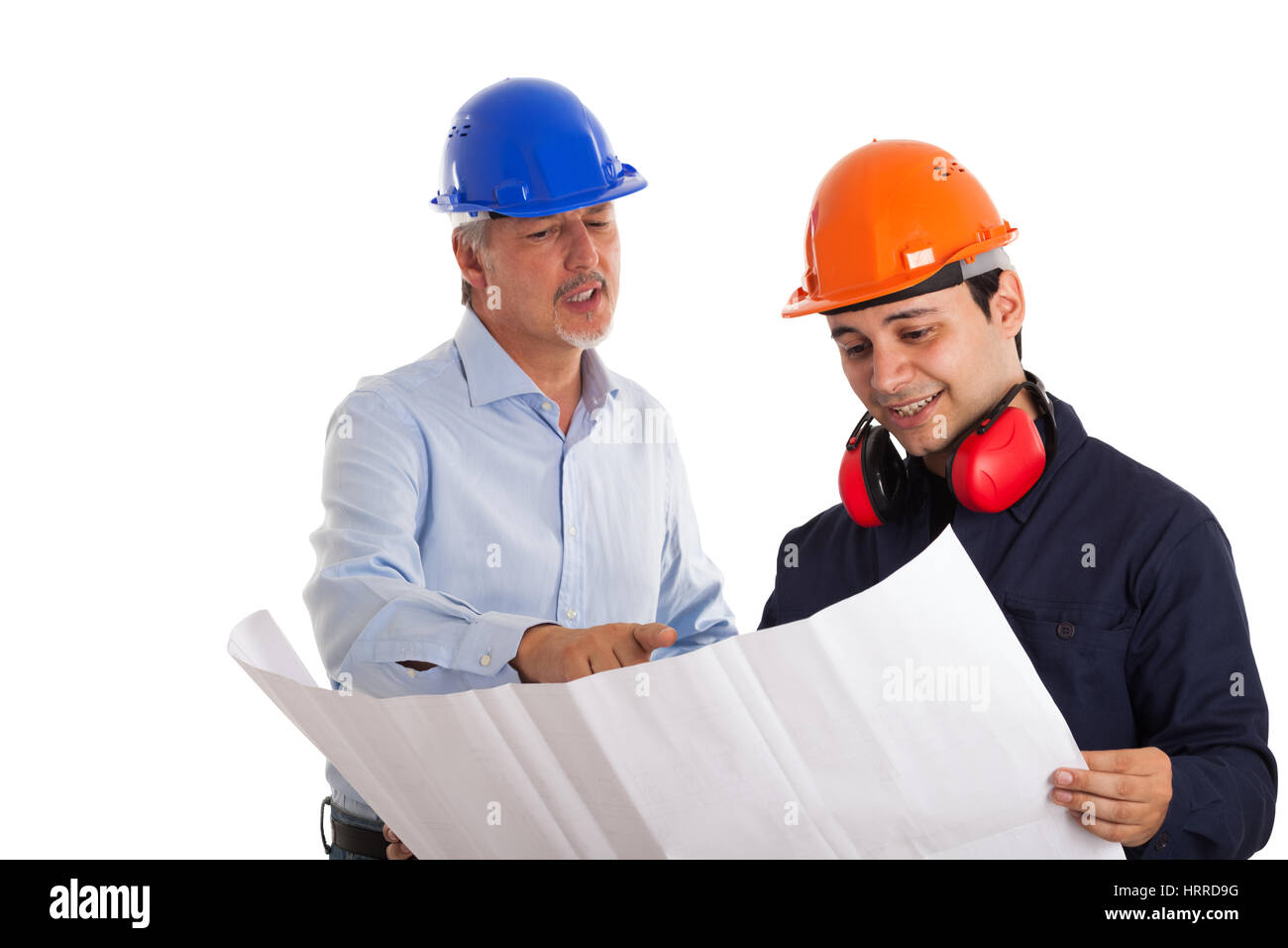 Engineer explaining a drawing to a worker Stock Photo - Alamy