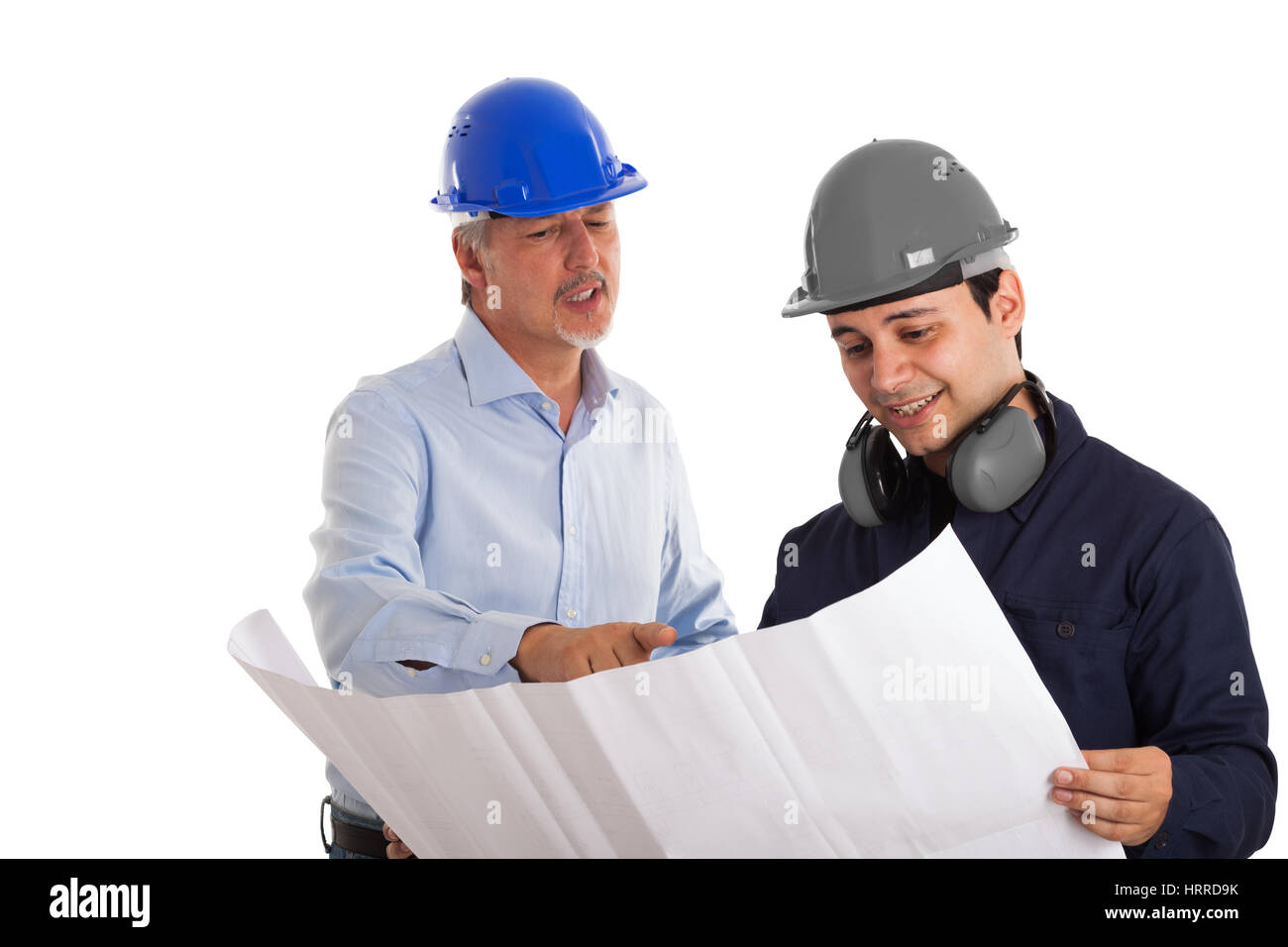 Engineer explaining a drawing to a worker Stock Photo - Alamy