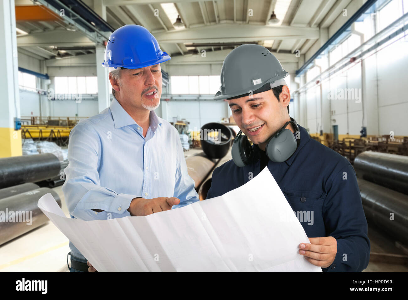 People at work in a factory Stock Photo - Alamy