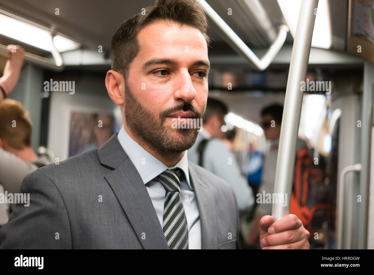 Portrait of a man traveling in a subway train Stock Photo - Alamy