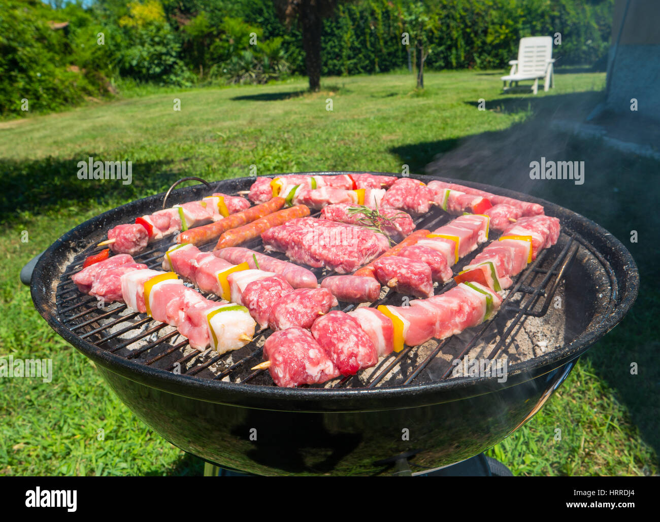 Meat on the a bbq grill Stock Photo - Alamy