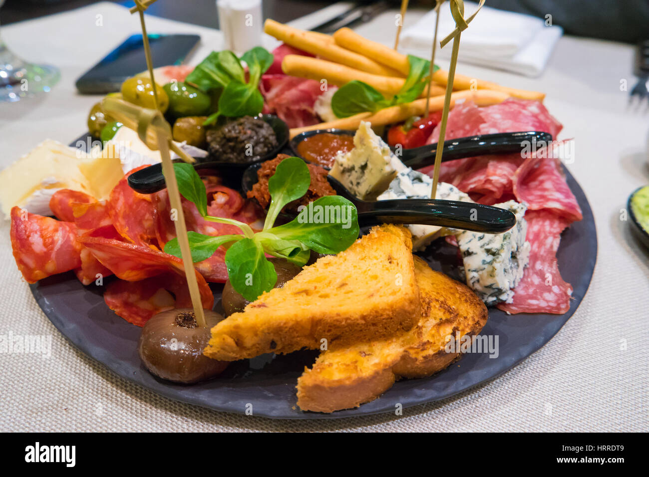 Mixed italian appetizers plate Stock Photo - Alamy