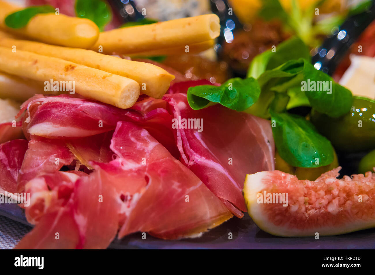 Close-up of a mixed italian appetizers plate Stock Photo - Alamy