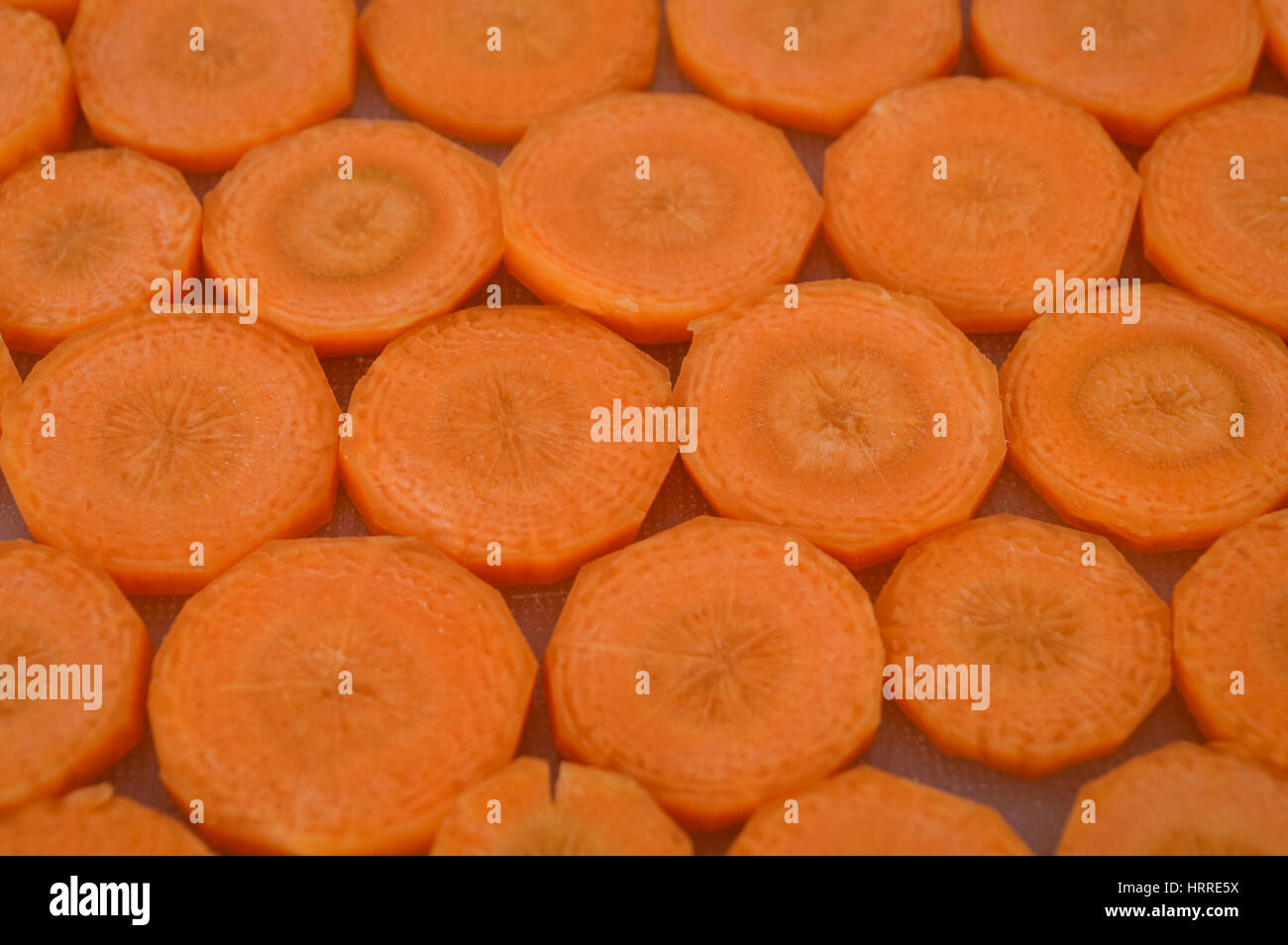 Fresh sliced carrots background texture Stock Photo - Alamy