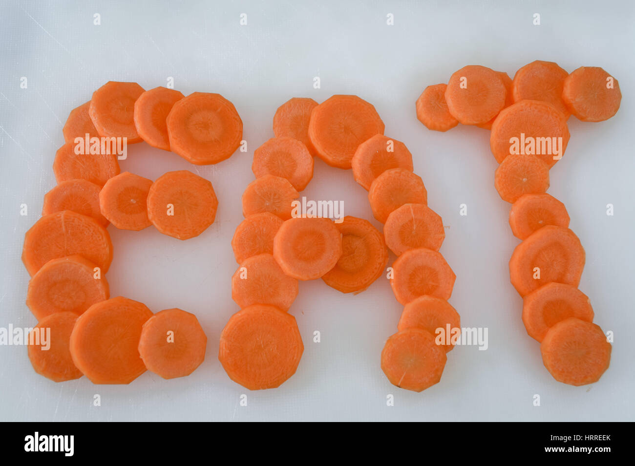 sliced carrots making the word eat, healthy eating concept Stock Photo ...