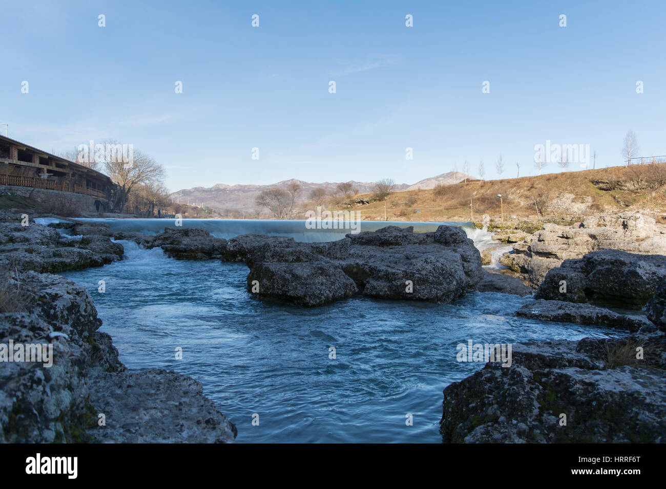 Beautiful blue river surrounded by rock formation Stock Photo - Alamy