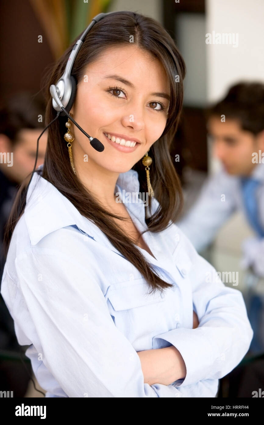 business customer service woman smiling in an office Stock Photo - Alamy