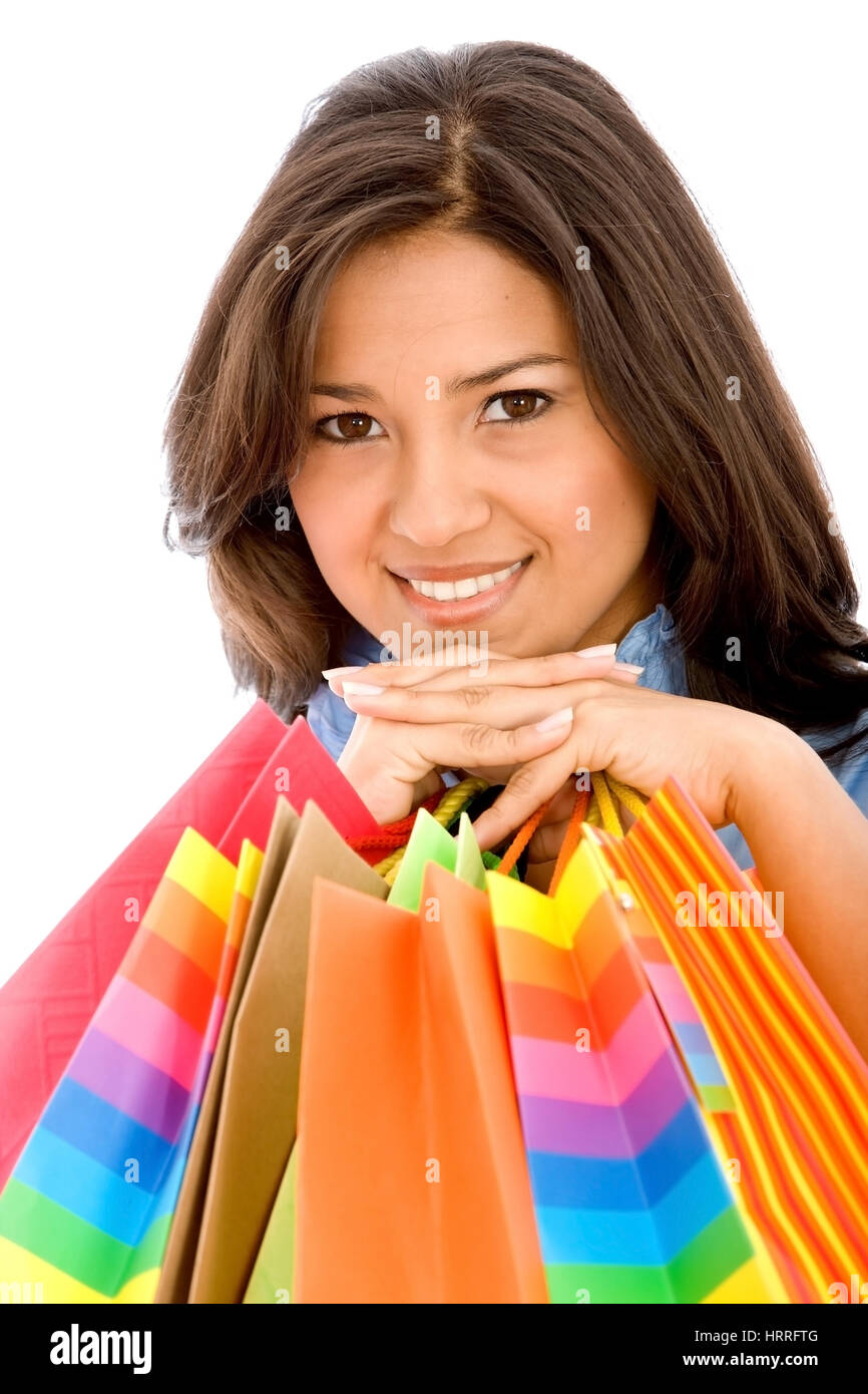 Casual woman wth shopping bags isolated over a white background Stock ...