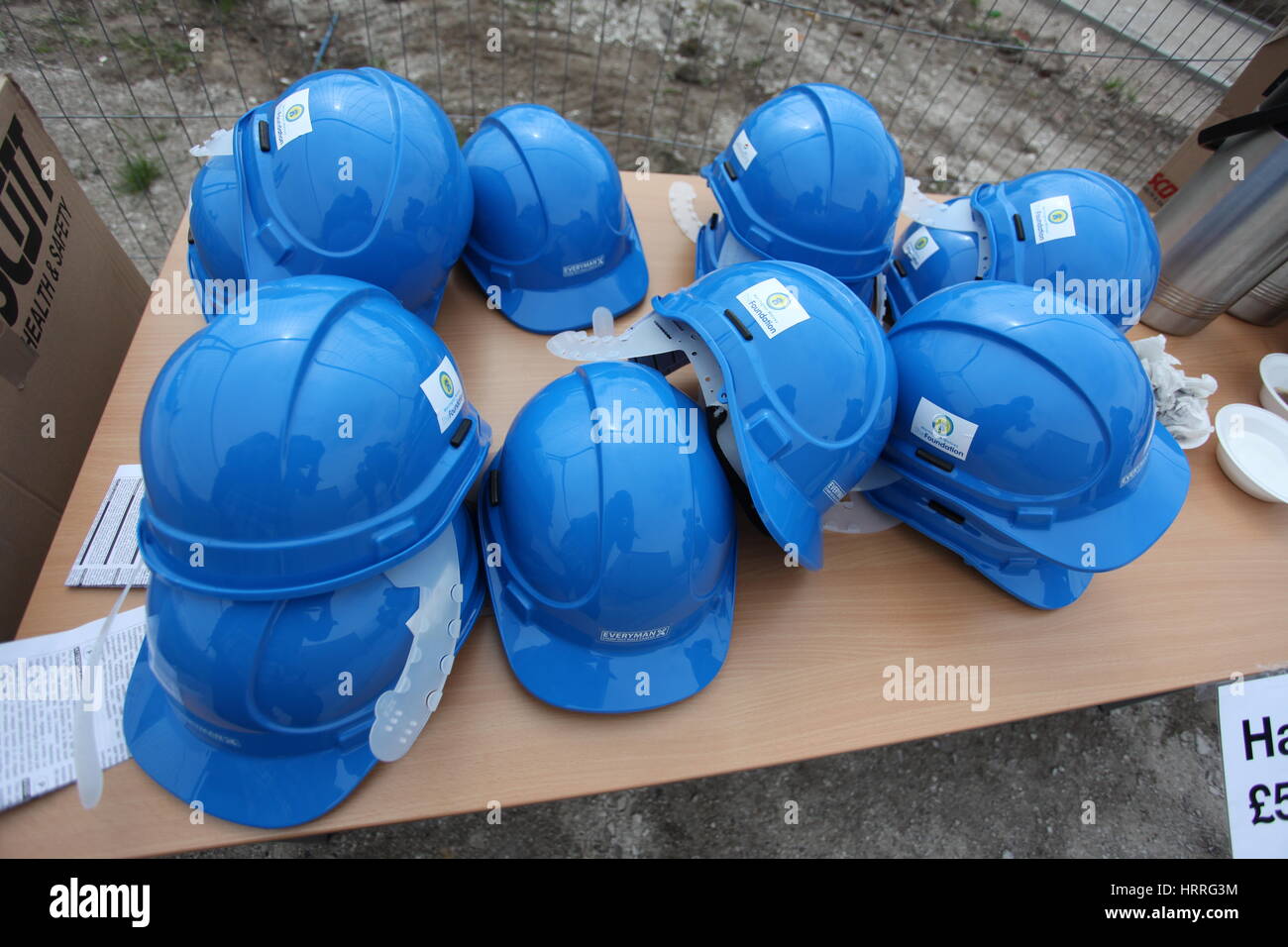 Blue safety hard hats Stock Photo - Alamy