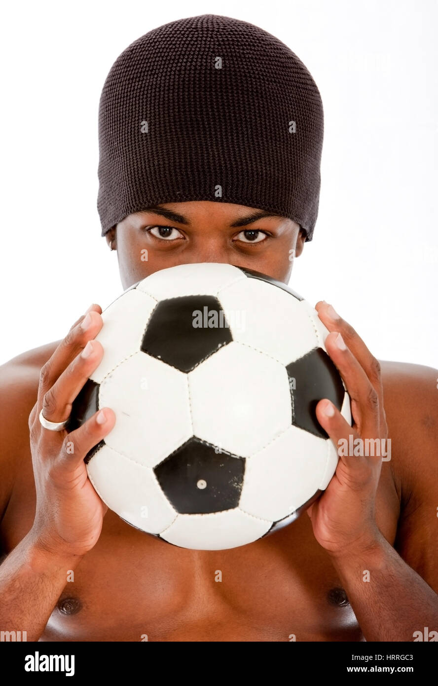 man with a football isolated over a white background Stock Photo - Alamy