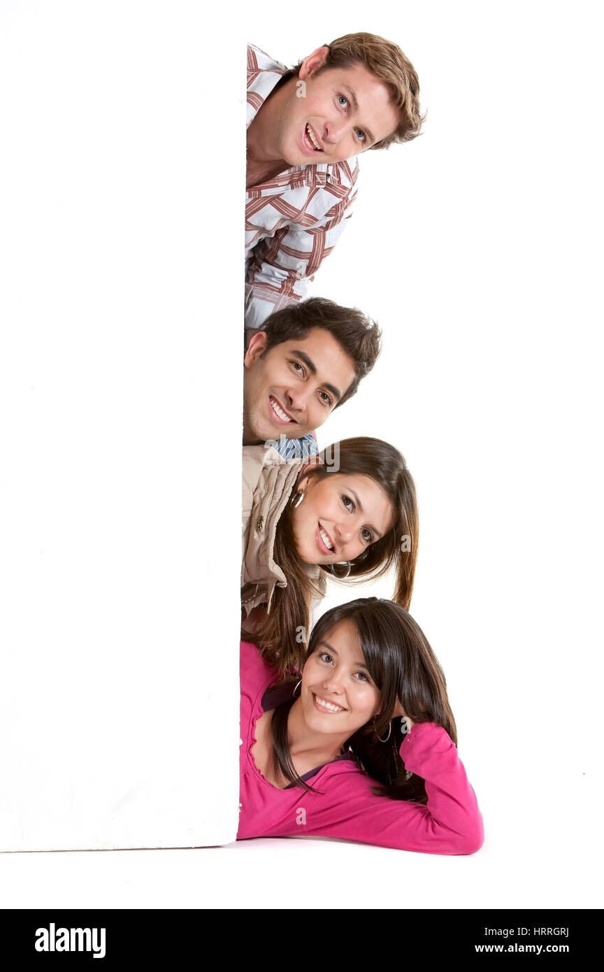happy group of friends holding a banner ad on the floor Stock Photo - Alamy