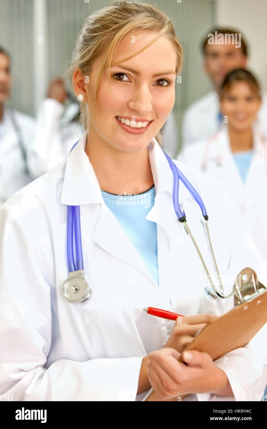 Female doctor with her team at a hospital Stock Photo - Alamy