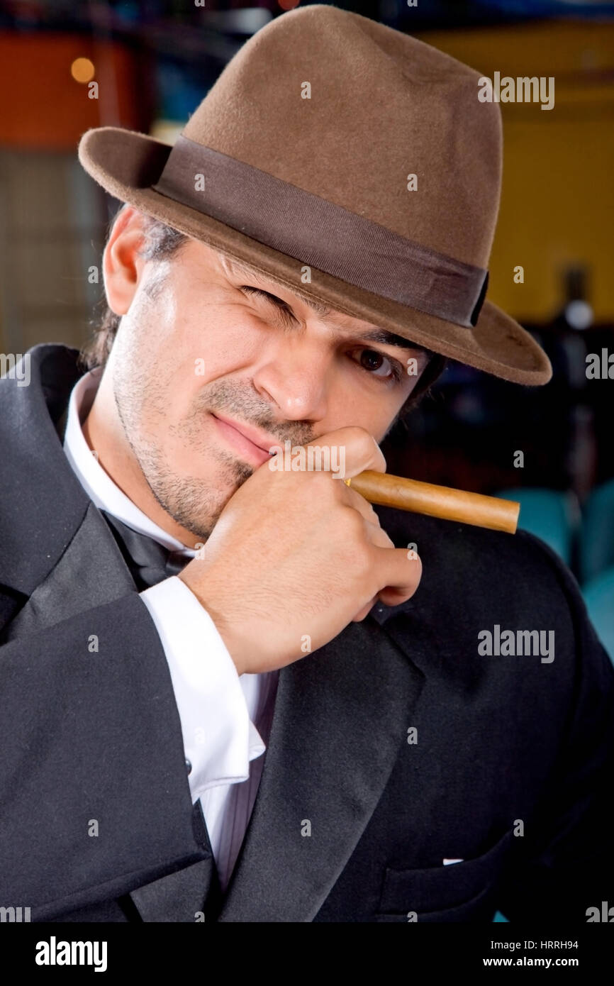 Handsome guy smoking cigar bar hi-res stock photography and images - Alamy