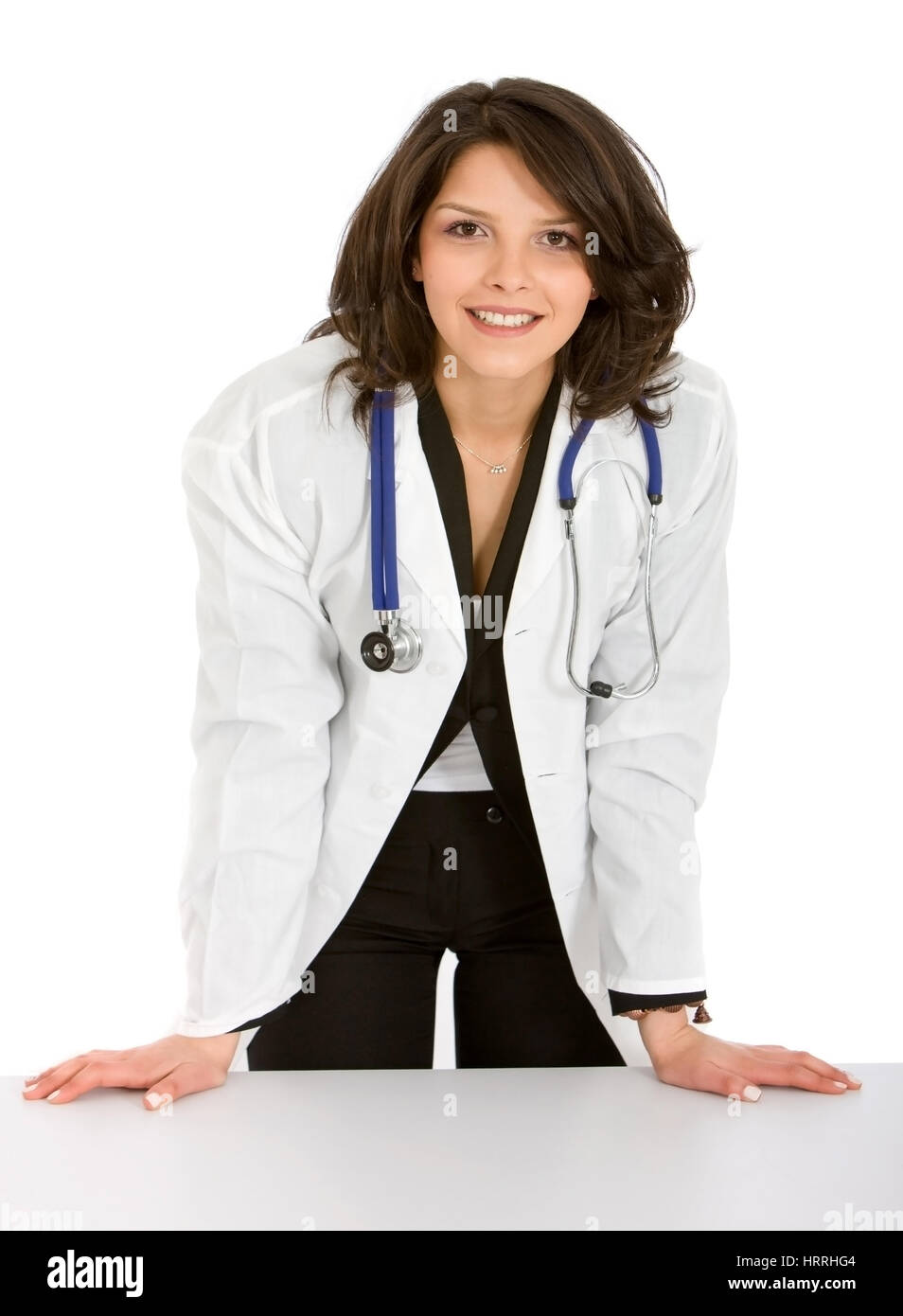 Friendly female doctor smiling isolated over a white Stock Photo - Alamy