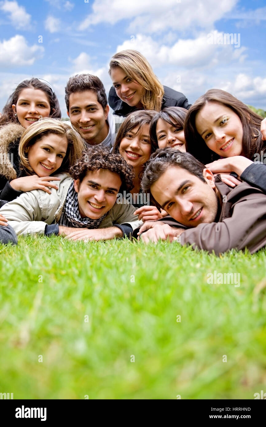happy group of friends smiling outdoors in a park Stock Photo - Alamy