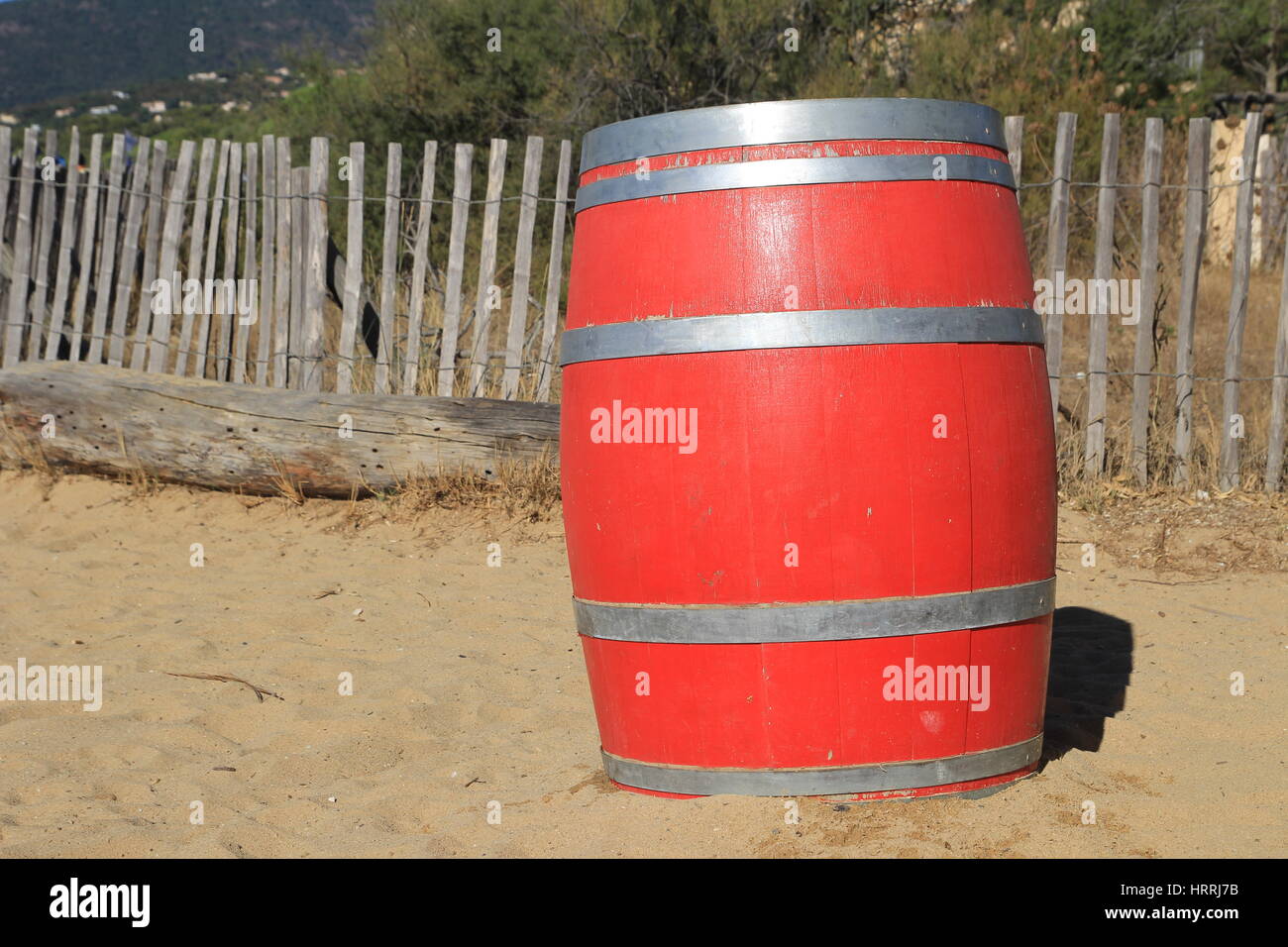 Bright red wooden barrel on a beach in tropical beach paradise with ...