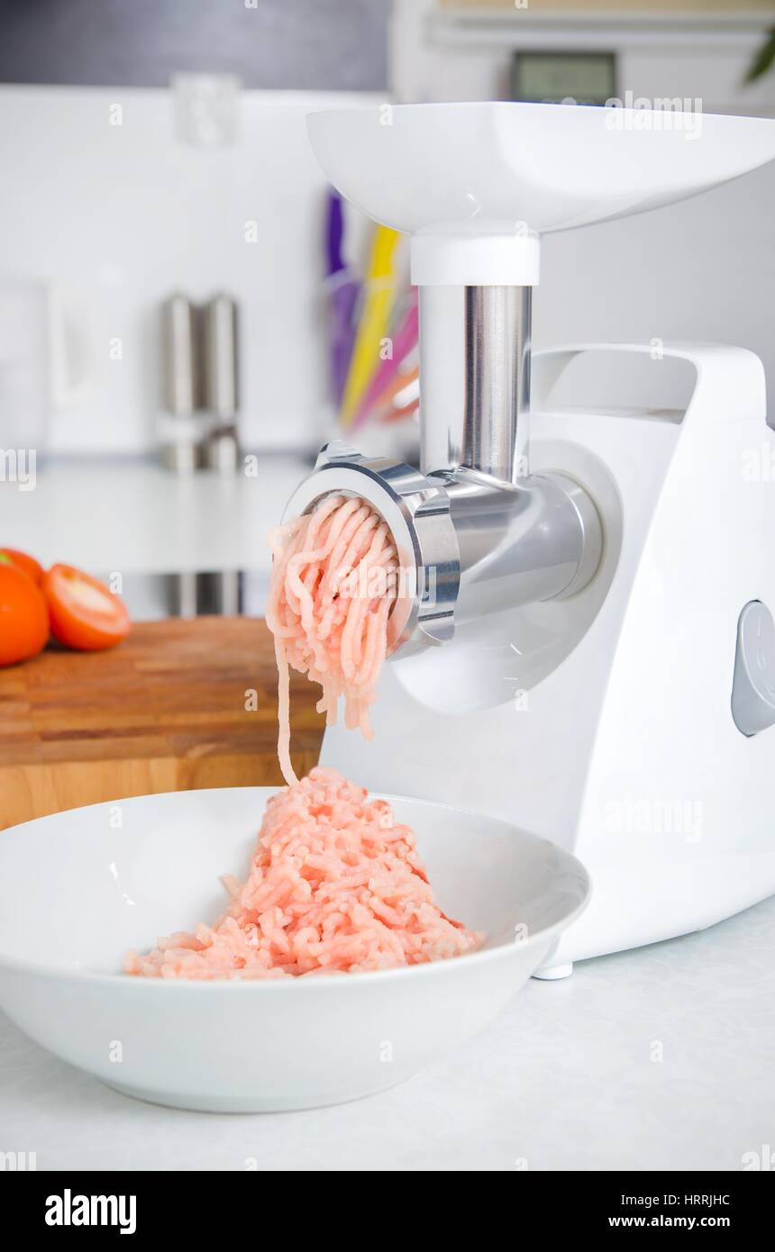Grinder with minced meat in modern kitchen Stock Photo - Alamy