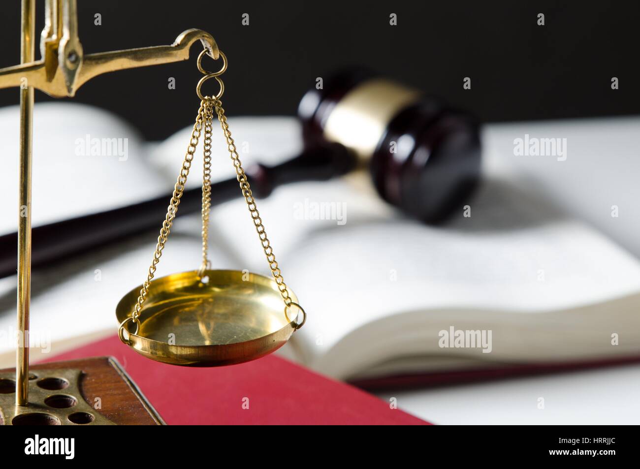 Scale of Justice. Law composition with gavel on books in background ...
