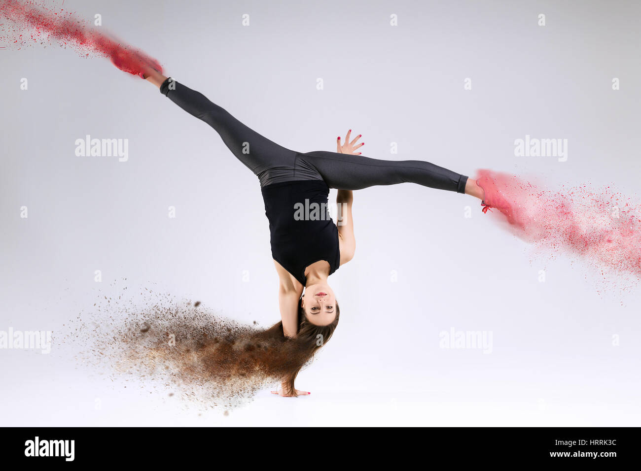 Woman in jump. Frozen motion. Photo manipulation of disintegration ...