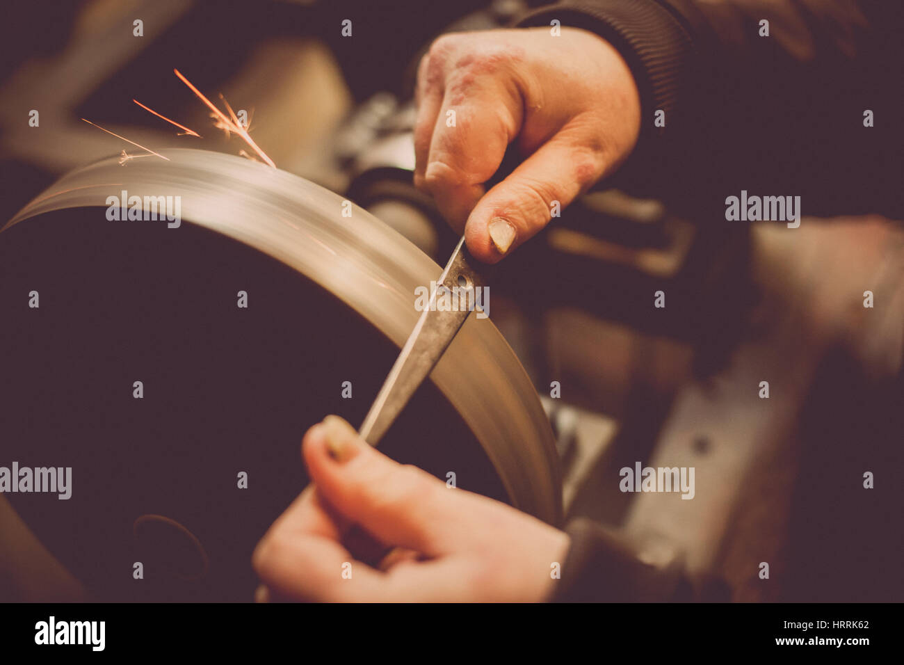 Hands sharpening blades hi-res stock photography and images - Alamy