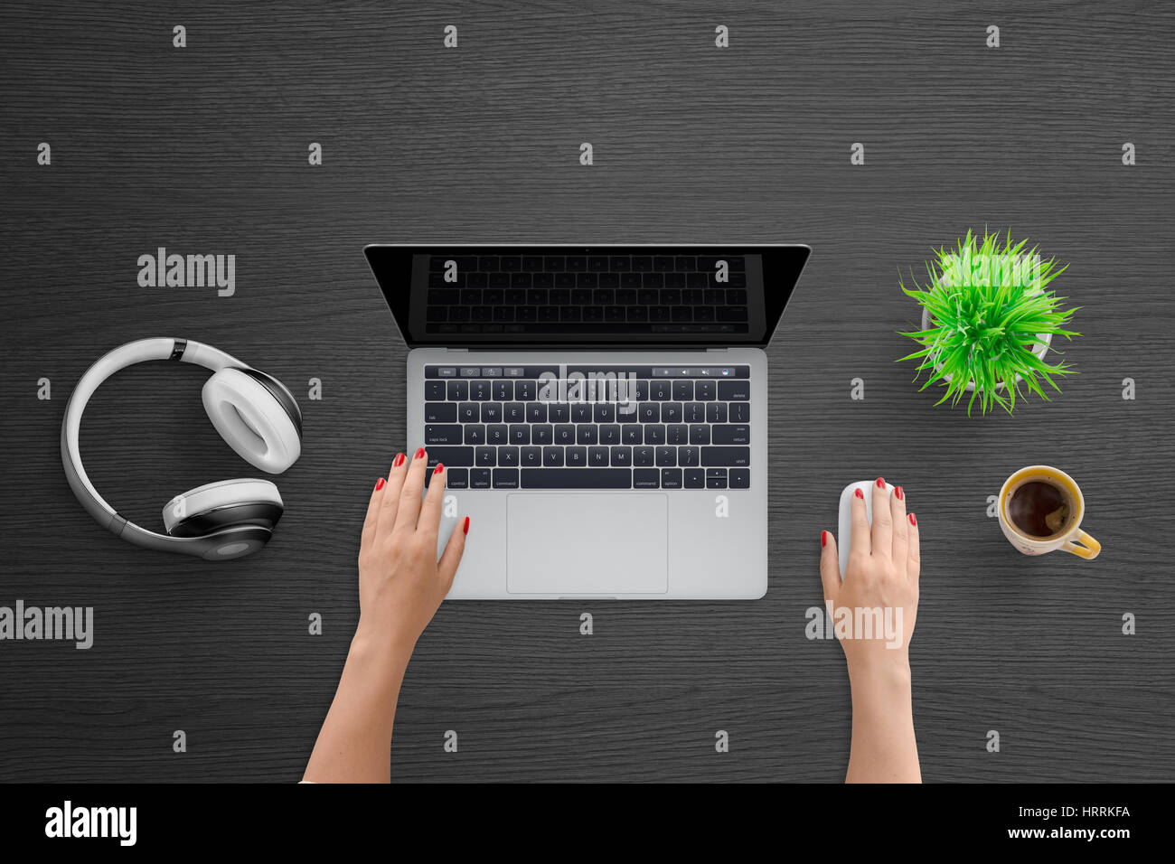 Top view of desk with laptop. Woman holding mouse and tap on keyboard ...