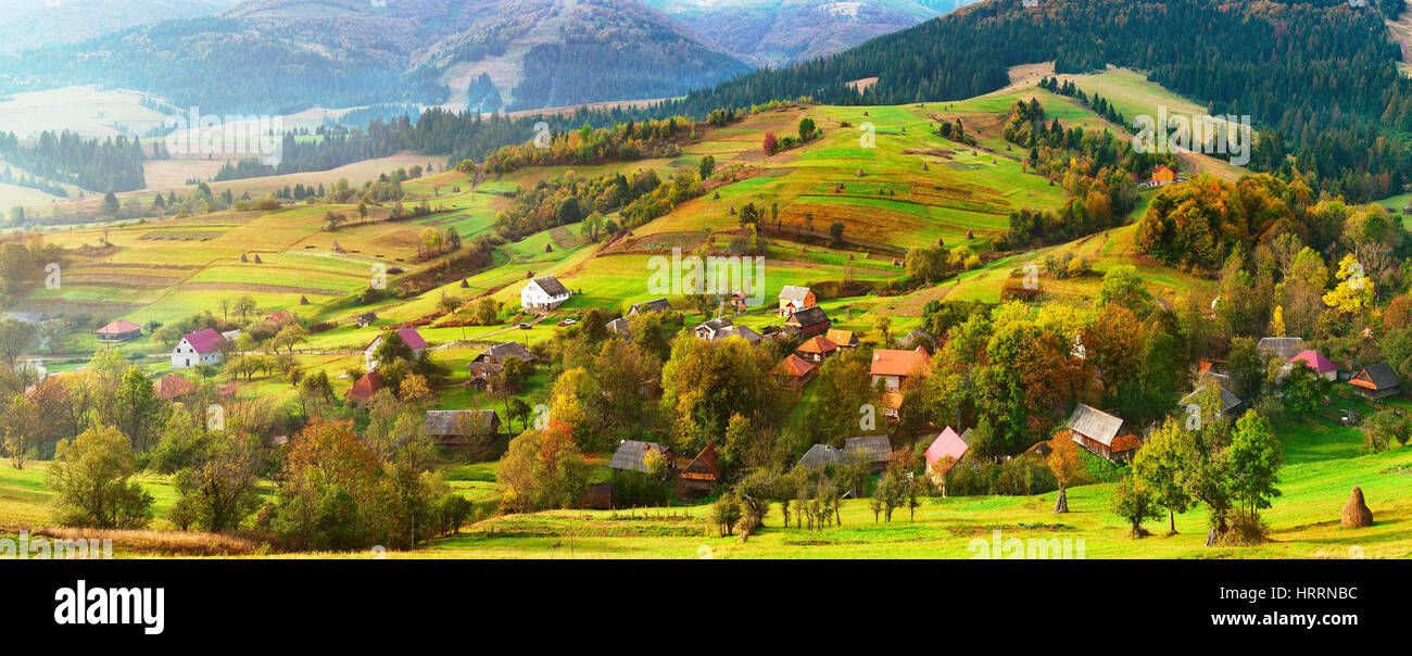 Small village on alpine hills in spring. Spring colors of Alps. Spring ...