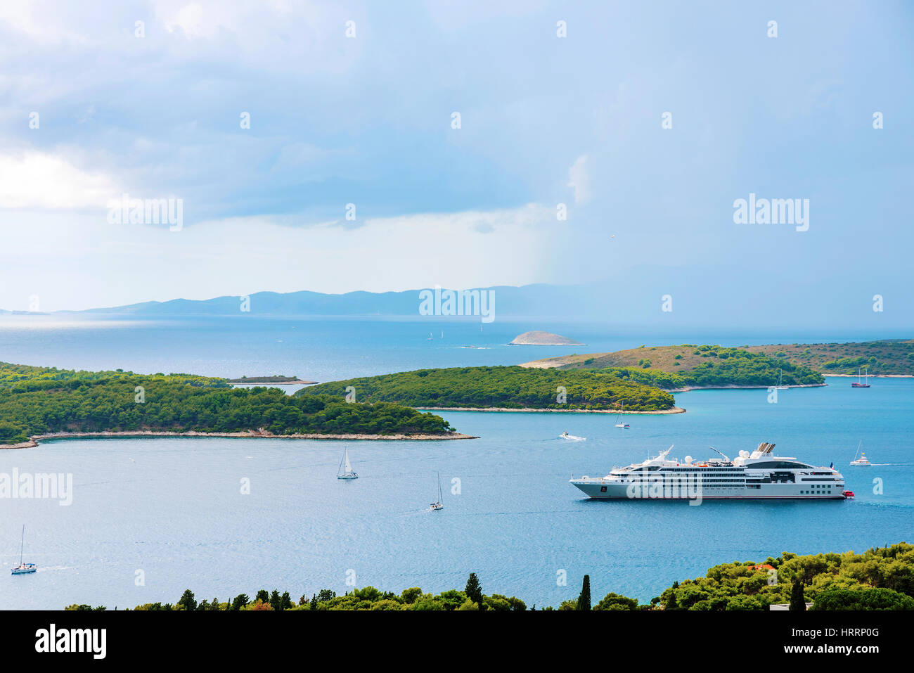 ship in the ocean with island Stock Photo - Alamy