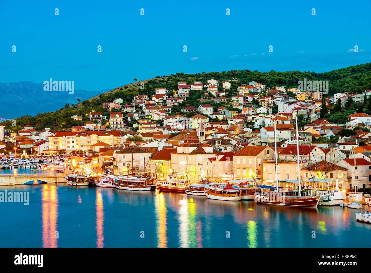 View of buildings on Trogir waterfront at night Stock Photo - Alamy