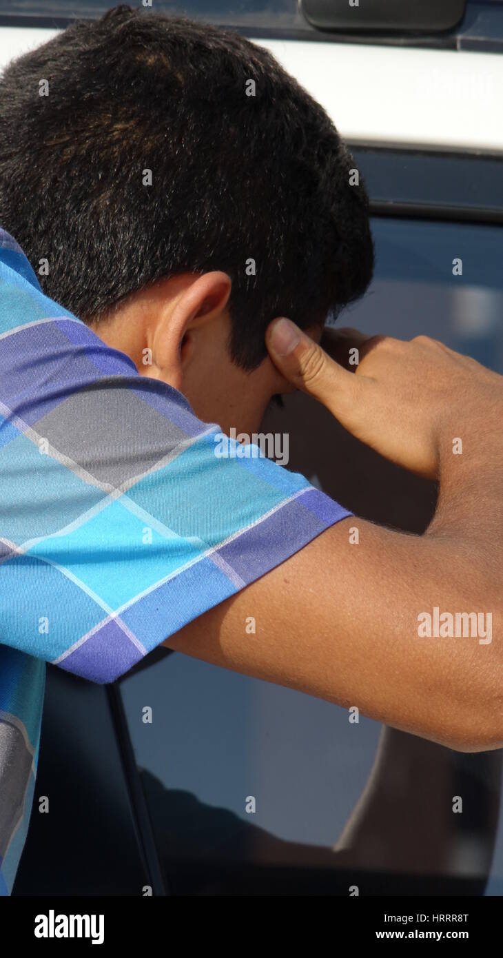 Thief Looking Into Car Window Stock Photo - Alamy