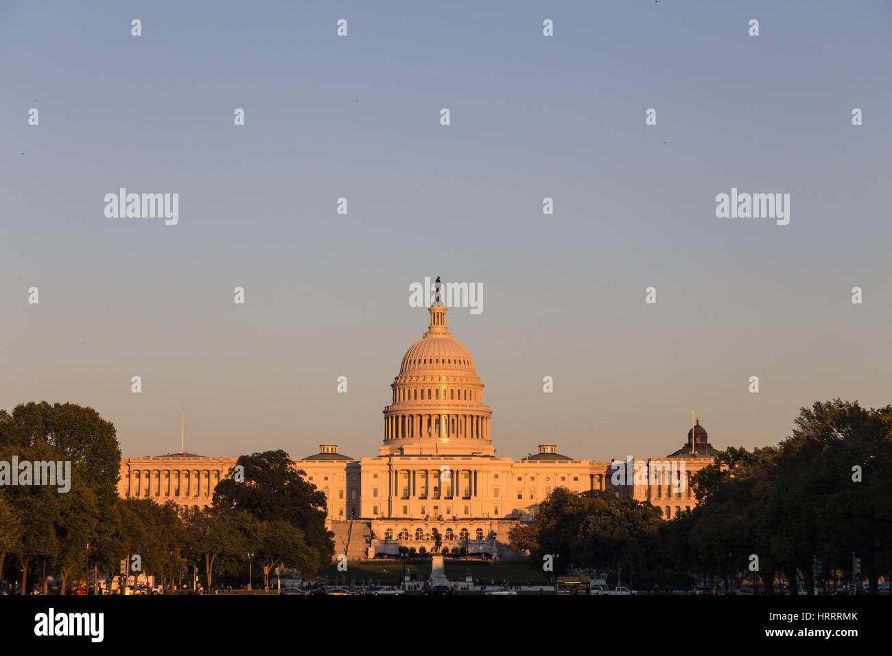 US Capitol illuminated by sunset sun Stock Photo - Alamy
