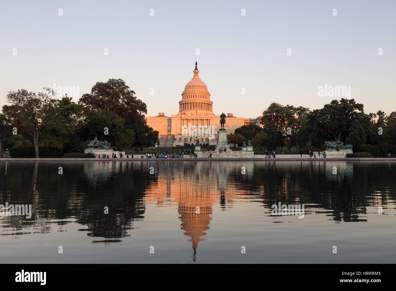US Capitol illuminated by sunset sun Stock Photo - Alamy