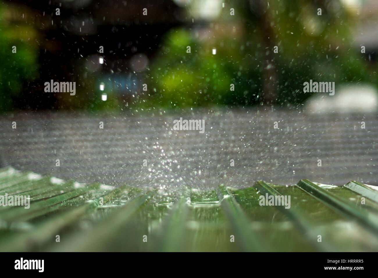 Rain pouring on roof Stock Photo - Alamy