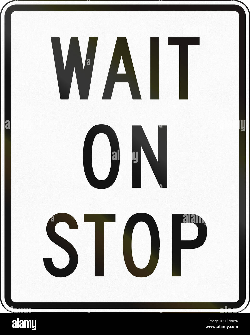 United States MUTCD road sign - Wait on stop Stock Photo - Alamy