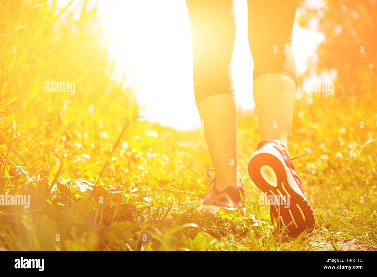 selective focus.. runner feet closeup. athlete in the park outdoors ...