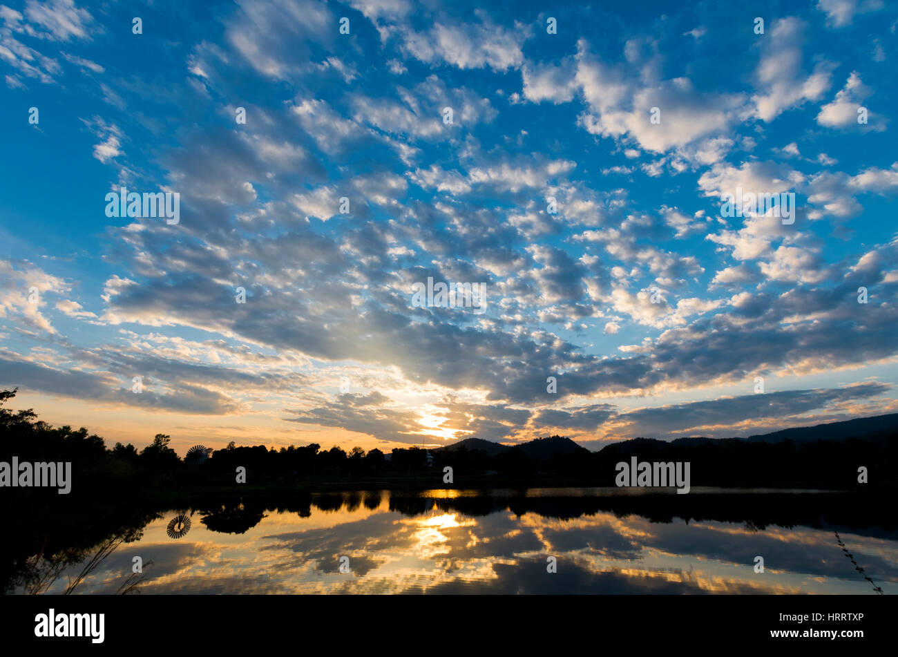 Sunset at the lake Stock Photo - Alamy