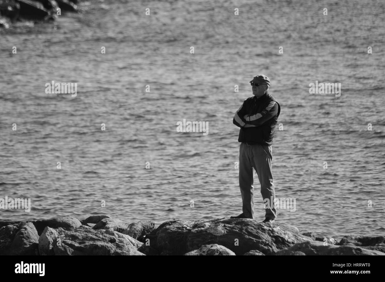 Man on the stone Black and White Stock Photos & Images - Alamy