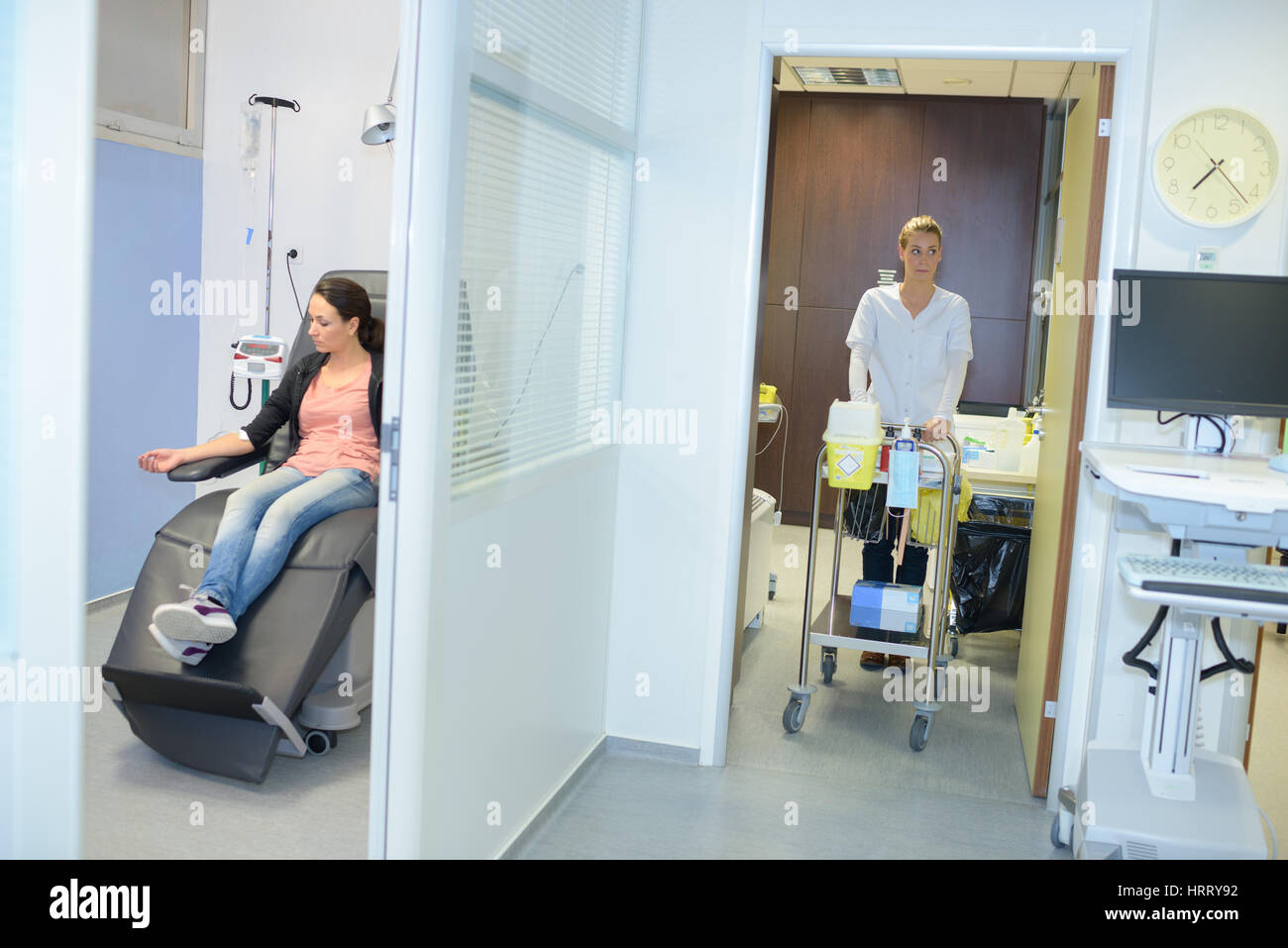 Trolley being wheeled to patient for blood test Stock Photo - Alamy