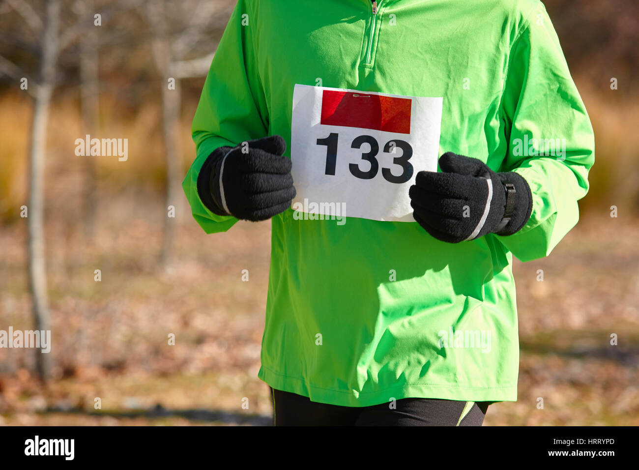 Senior athletics runner on a race. Outdoor circuit. Winter time ...