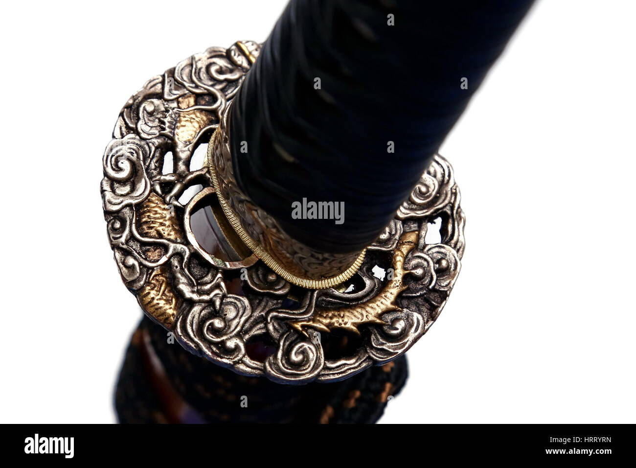 Tsuba : hand guard of Japanese sword with white background Stock Photo ...