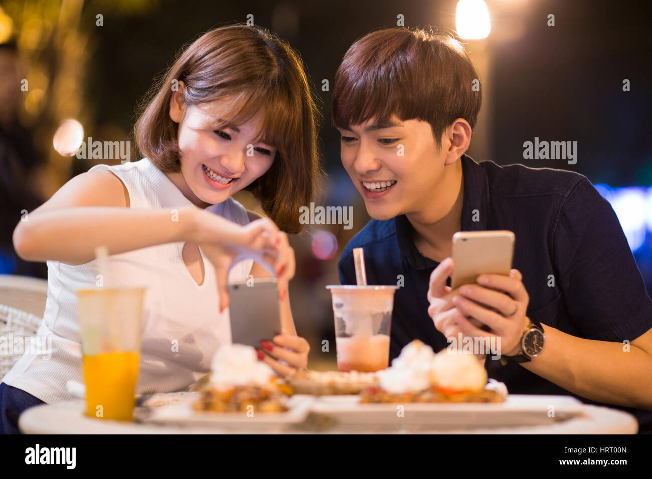 Happy young couple dating Stock Photo - Alamy