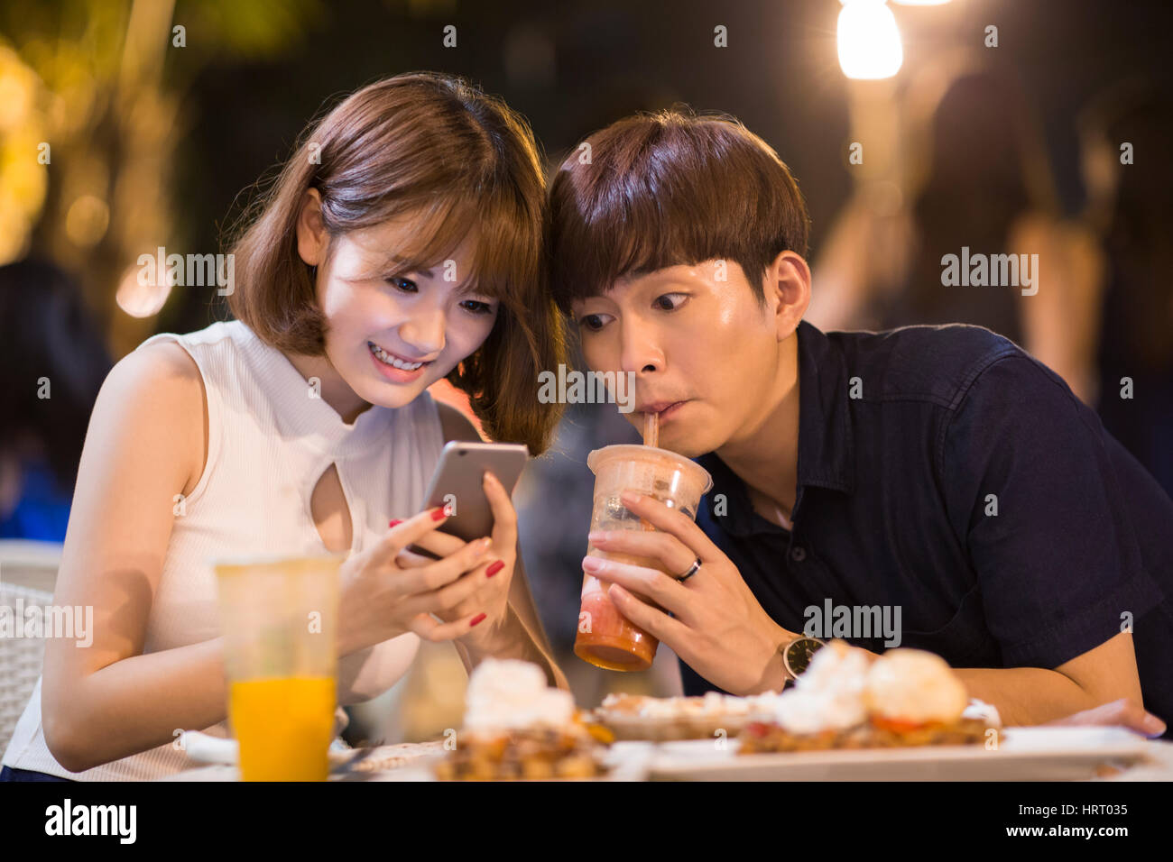 Happy young couple dating Stock Photo - Alamy