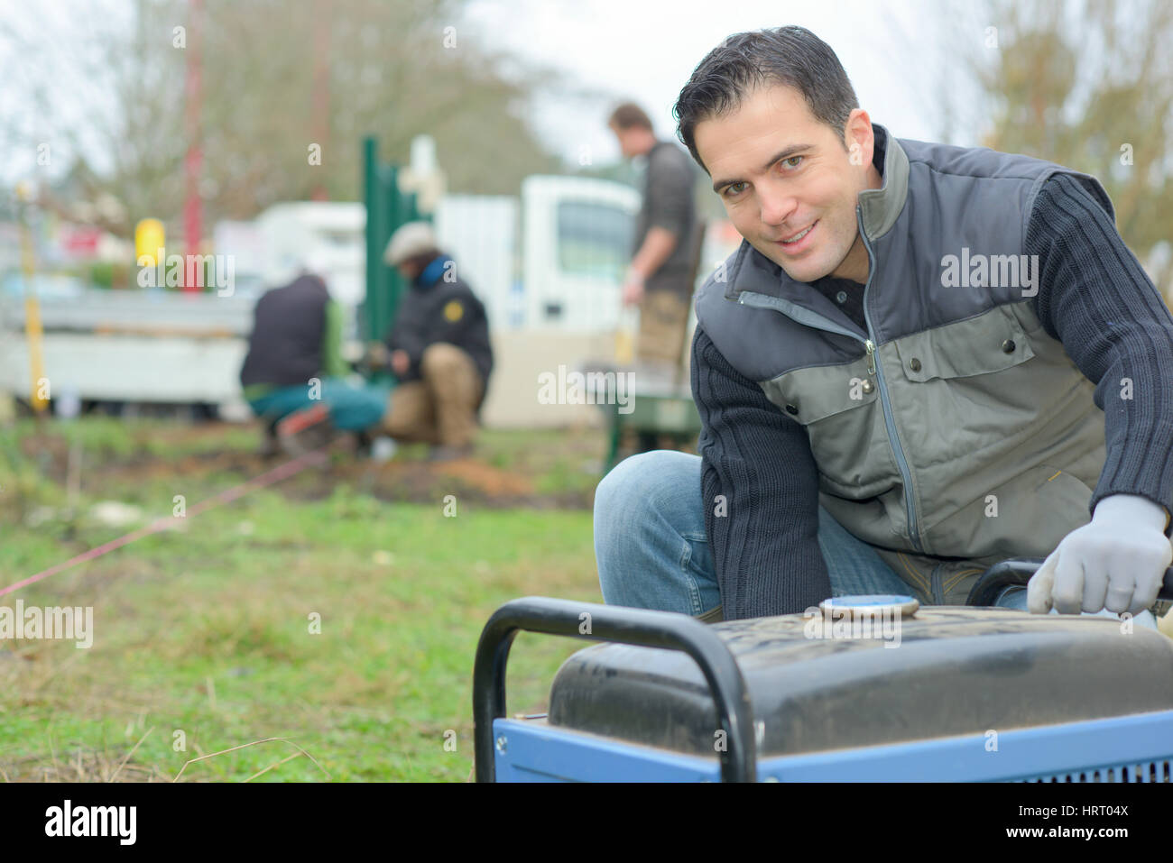 Using a portable power generator Stock Photo - Alamy