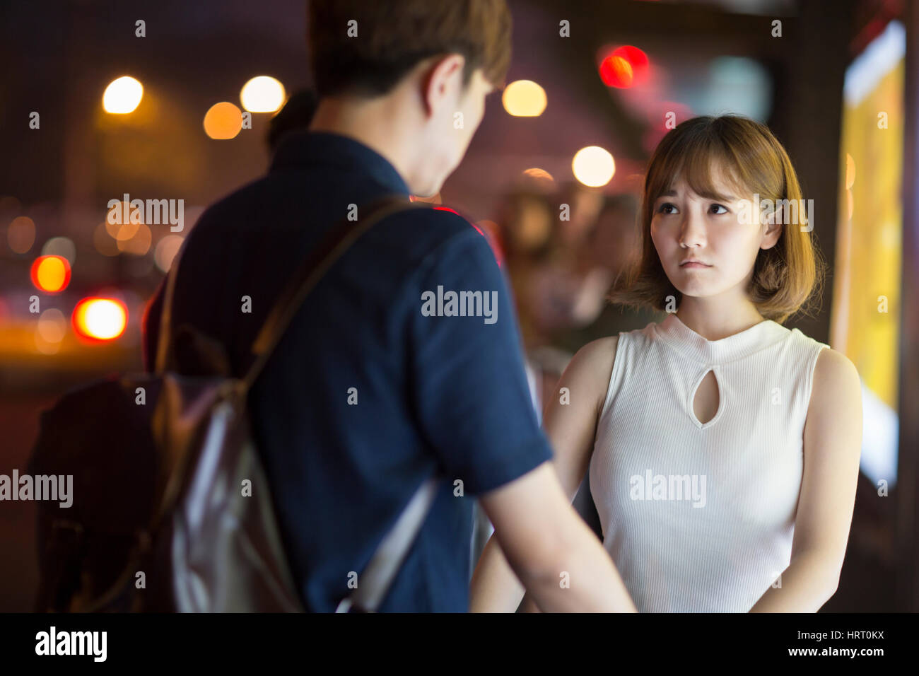 Young couple at the bus stop Stock Photo - Alamy