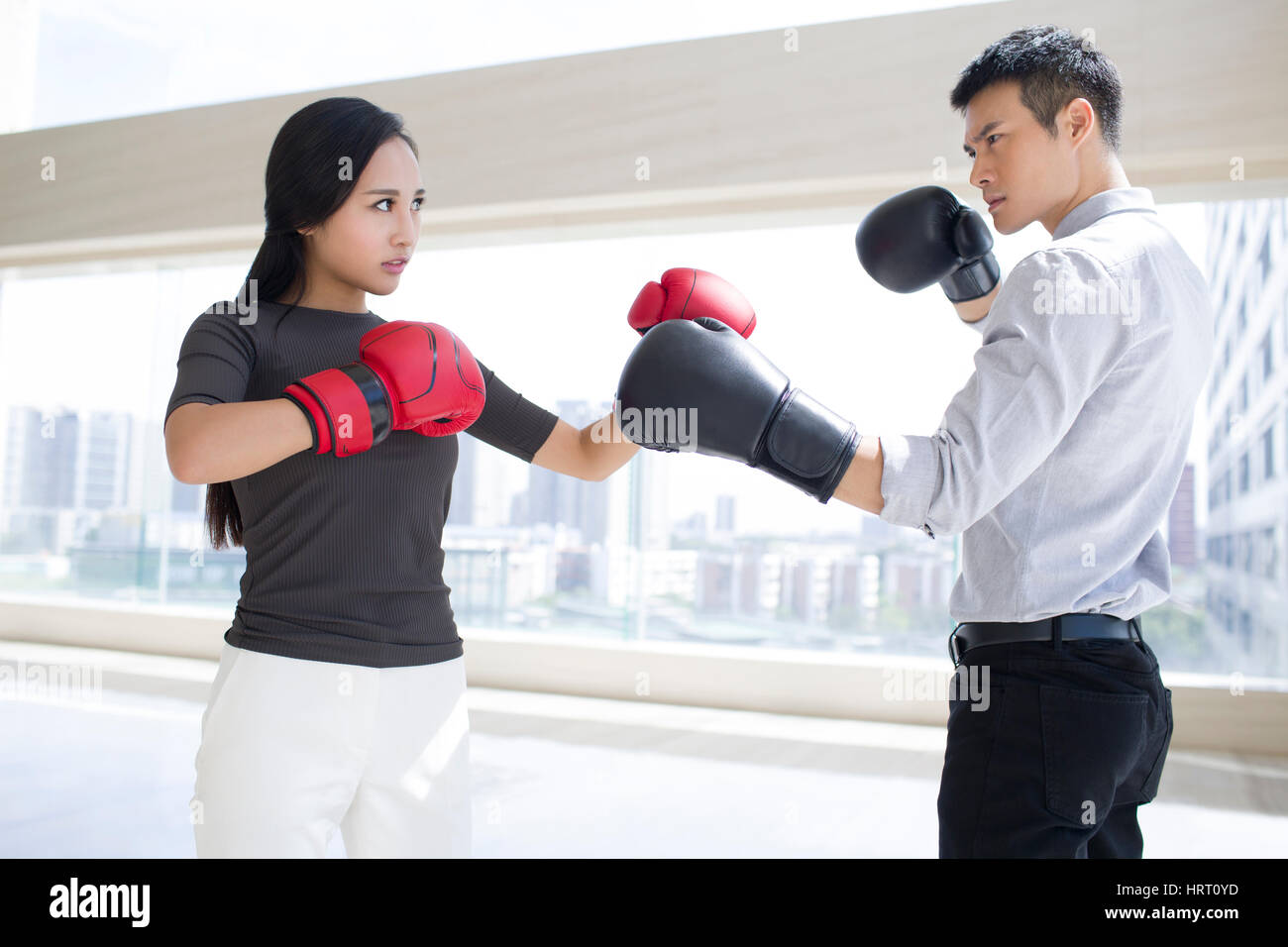 Three business people fighting hi-res stock photography and images - Alamy
