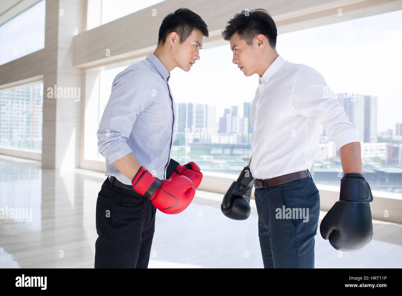 Three business people fighting hi-res stock photography and images - Alamy